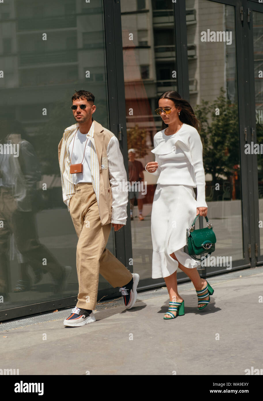 Trendy women and men pose for street snap during the Paris Fashion Week ...