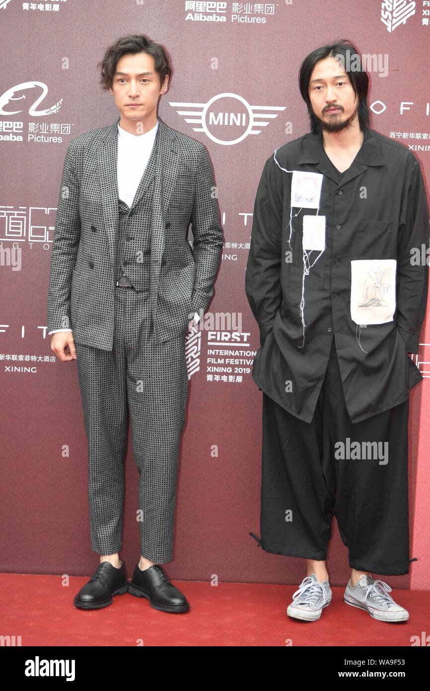 Chinese actor and singer Hu Ge, left, and actor Eric Wang pose as they ...