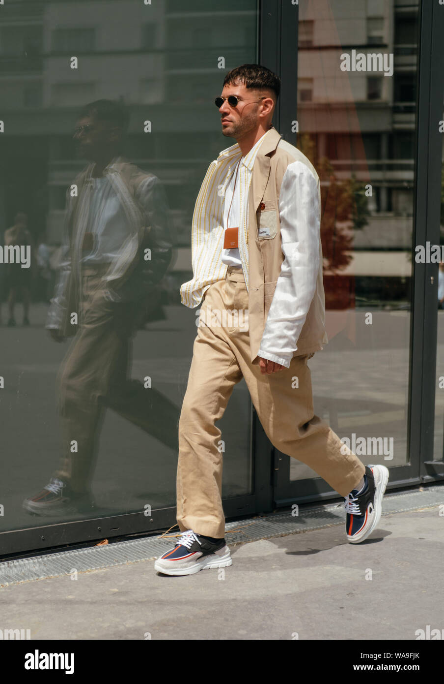 Trendy women and men pose for street snap during the Paris Fashion Week ...