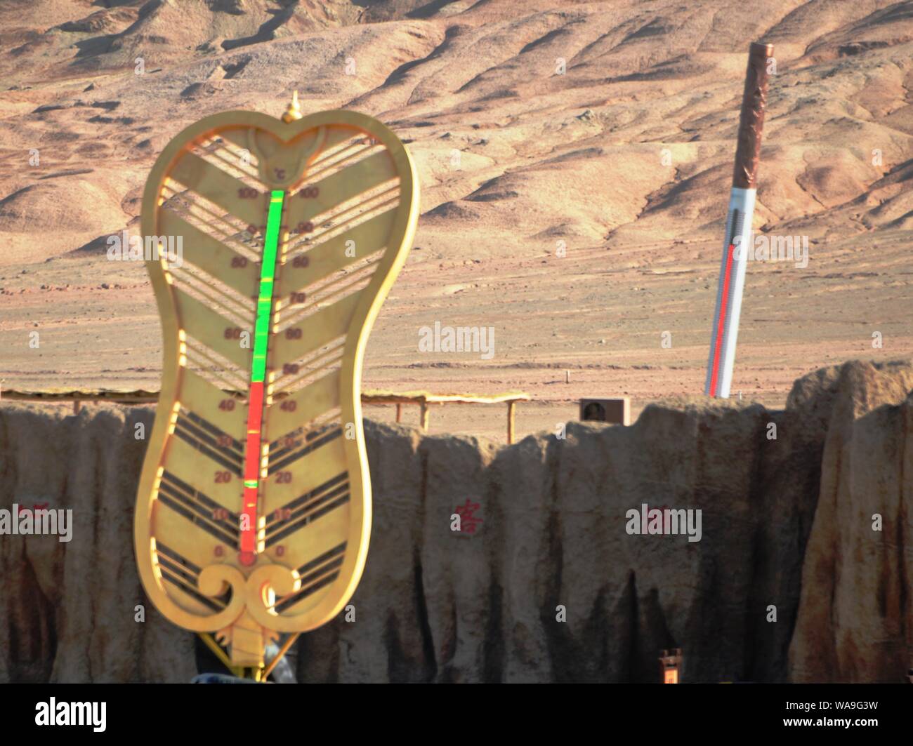A giant thermometer featuring shape of Plantain Fan shows the current ...