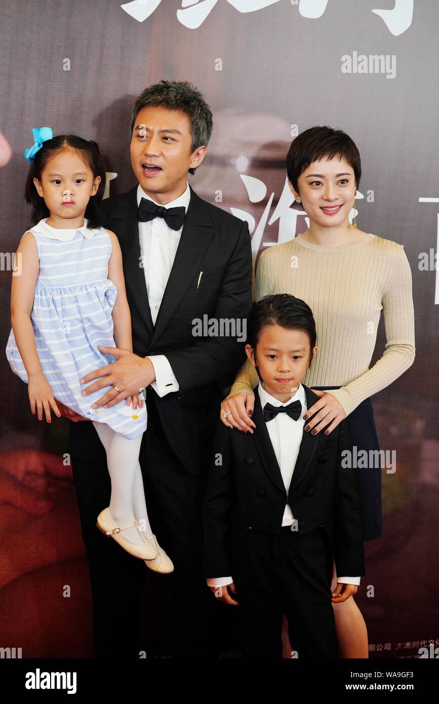 Chinese actor Deng Chao, left, his actress wife Sun Li, right, their ...
