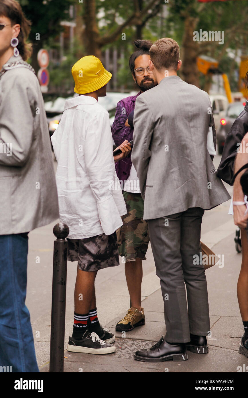 Trendy women and men pose for street snap during the Paris Fashion Week ...