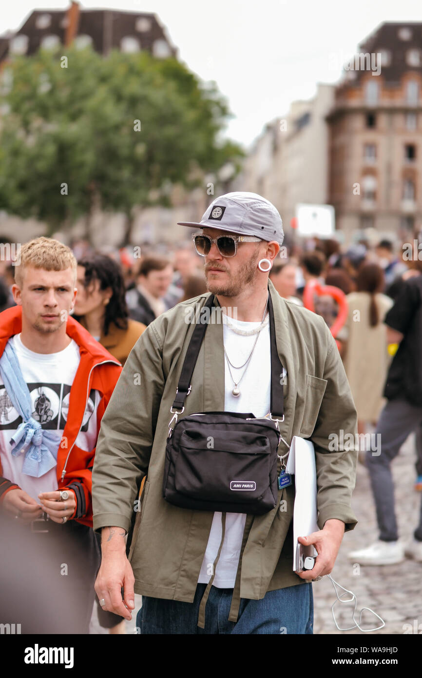 Trendy women and men pose for street snap during the Paris Fashion Week ...