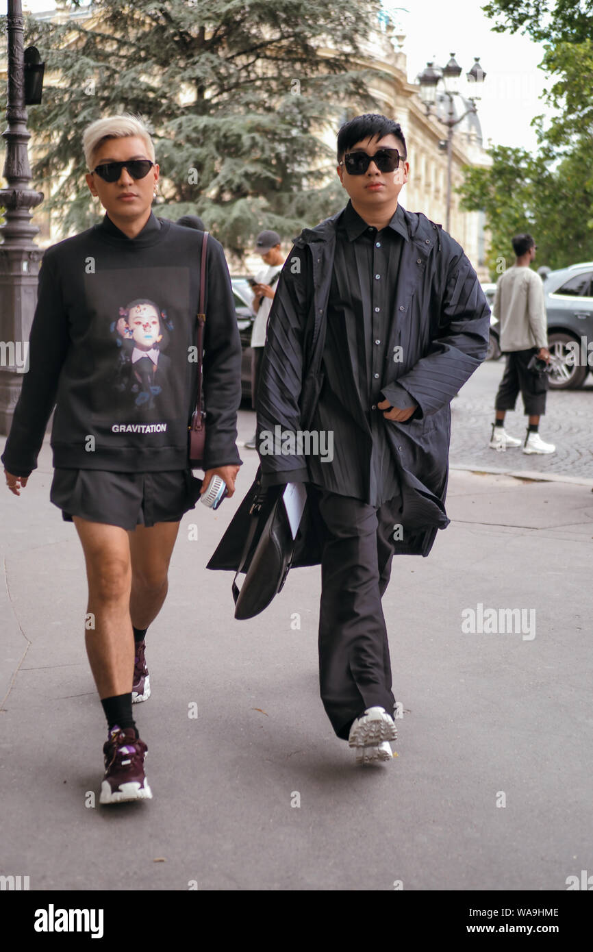 Trendy women and men pose for street snap during the Paris Fashion Week ...
