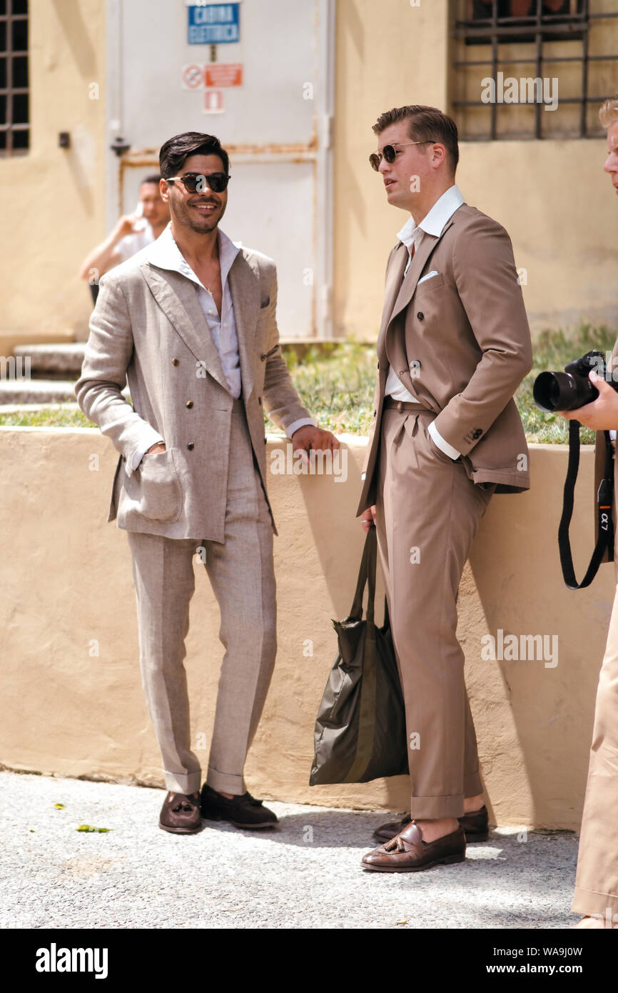 Trendy women and men pose for street snap during the Florence Fashion ...