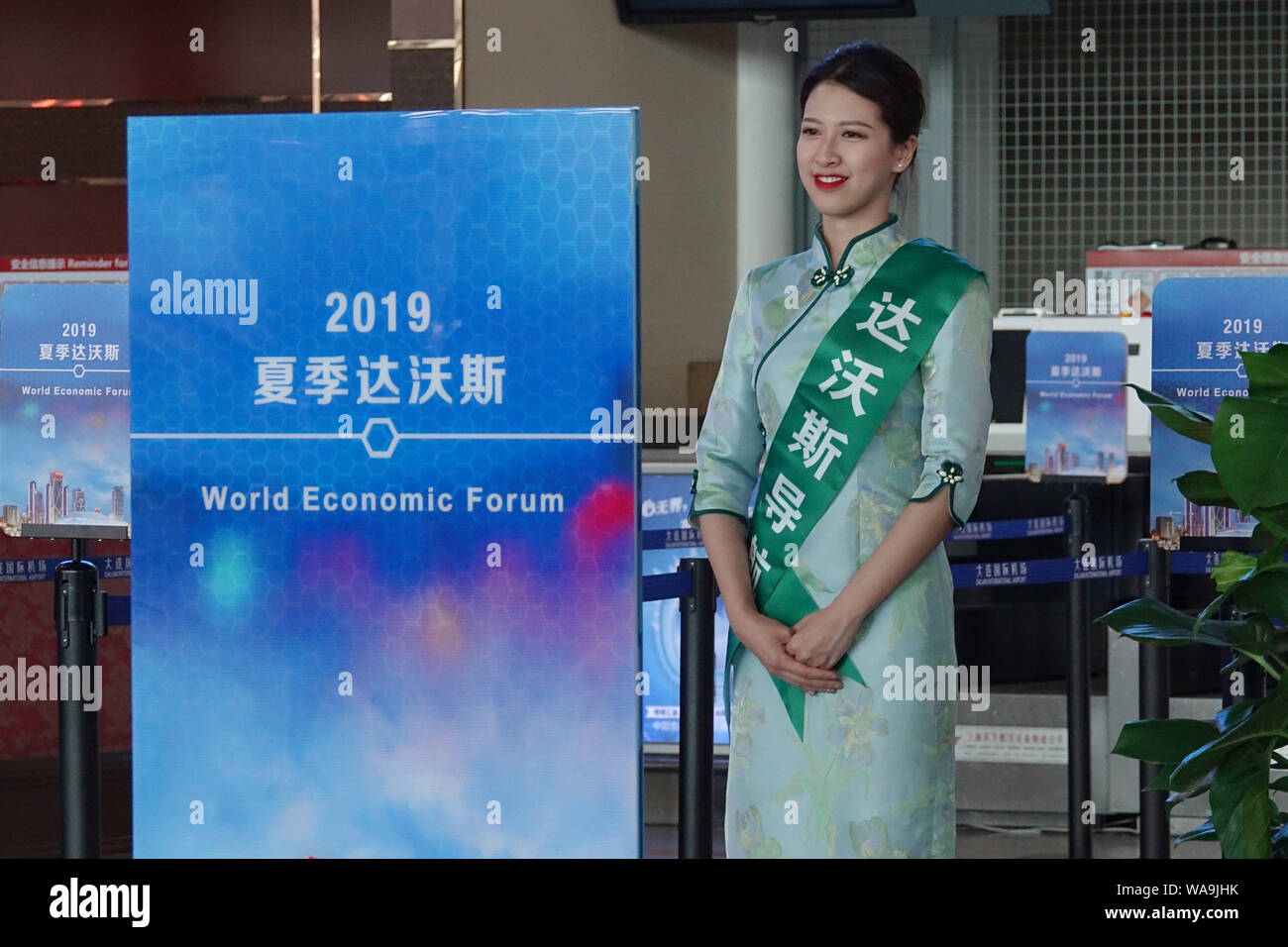 Chinese hostesses dressed in Cheongsam, a traditional Chinese dresses ...