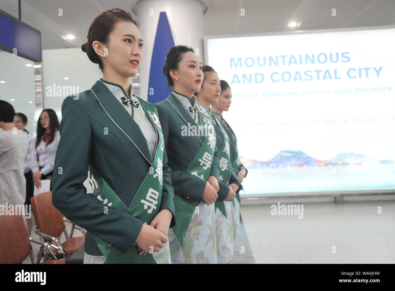 Chinese hostesses dressed in Cheongsam, a traditional Chinese dresses ...