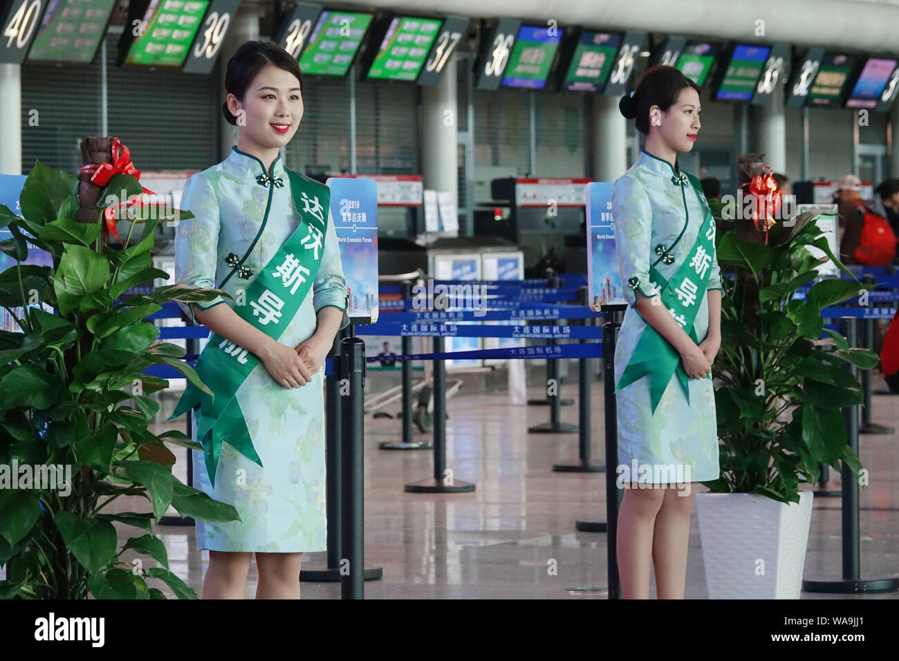 Chinese hostesses dressed in Cheongsam, a traditional Chinese dresses ...