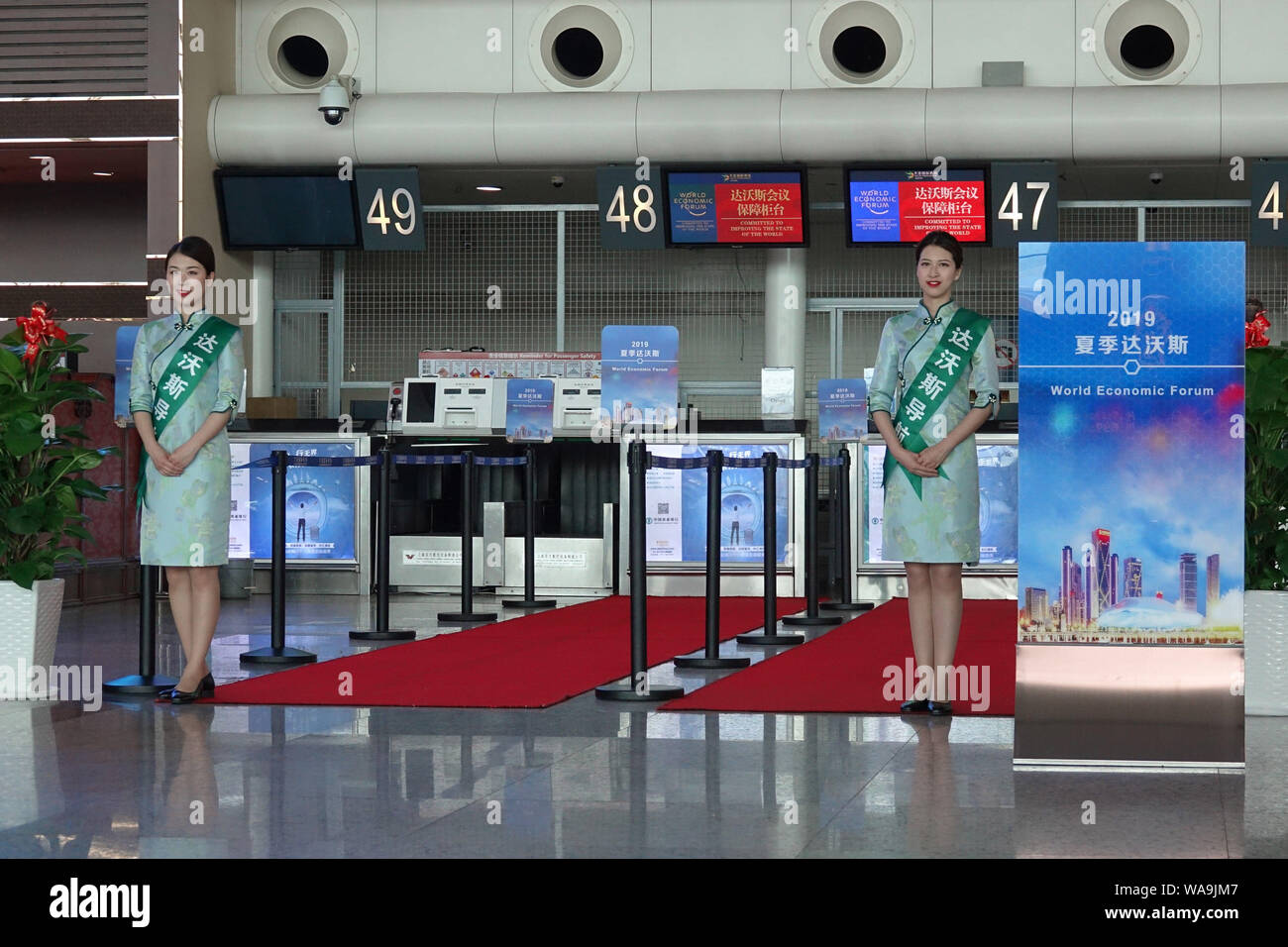 Chinese hostesses dressed in Cheongsam, a traditional Chinese dresses ...