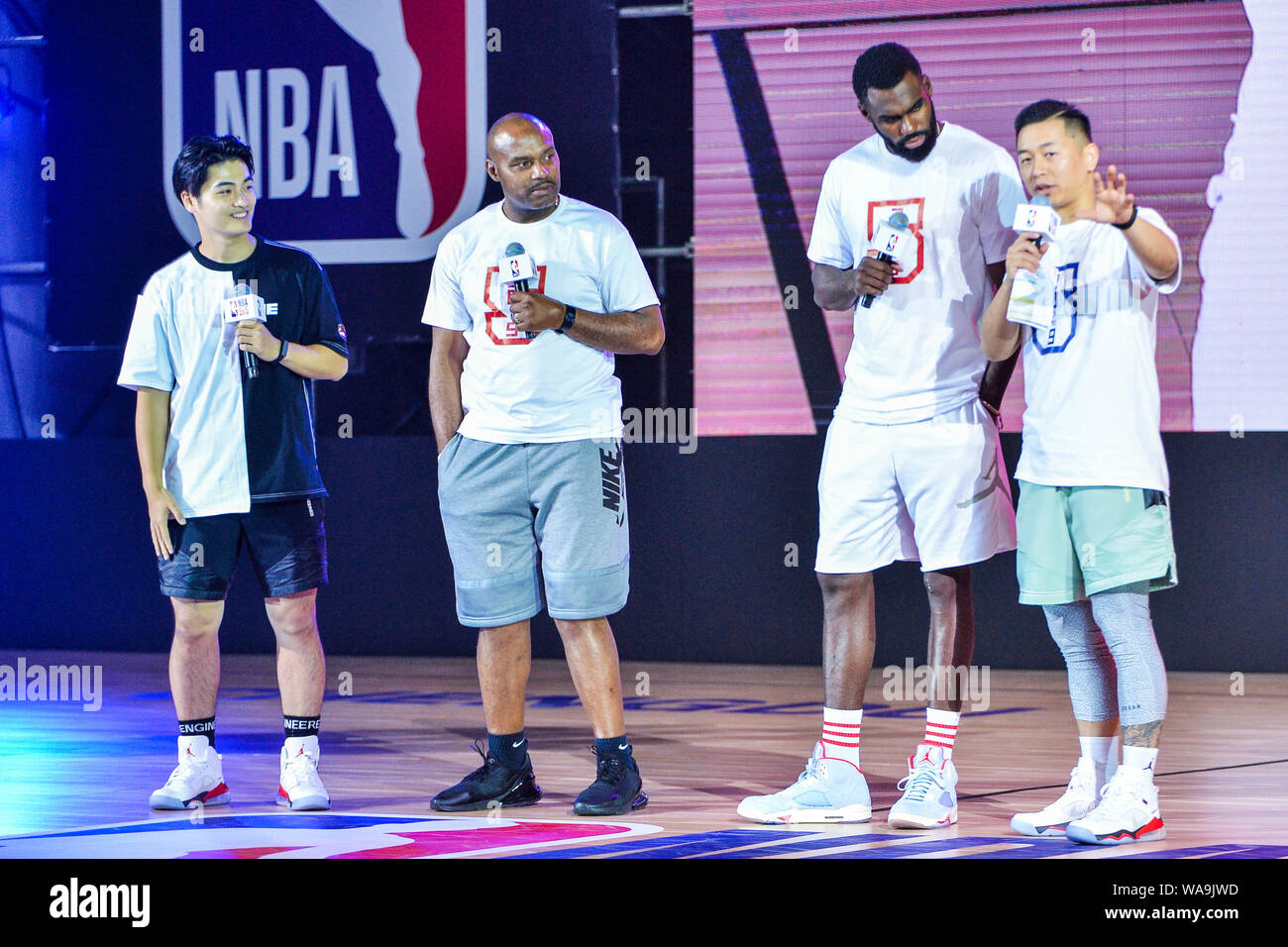 NBA star Tim Hardaway Jr., center left, of Dallas Mavericks, and ...