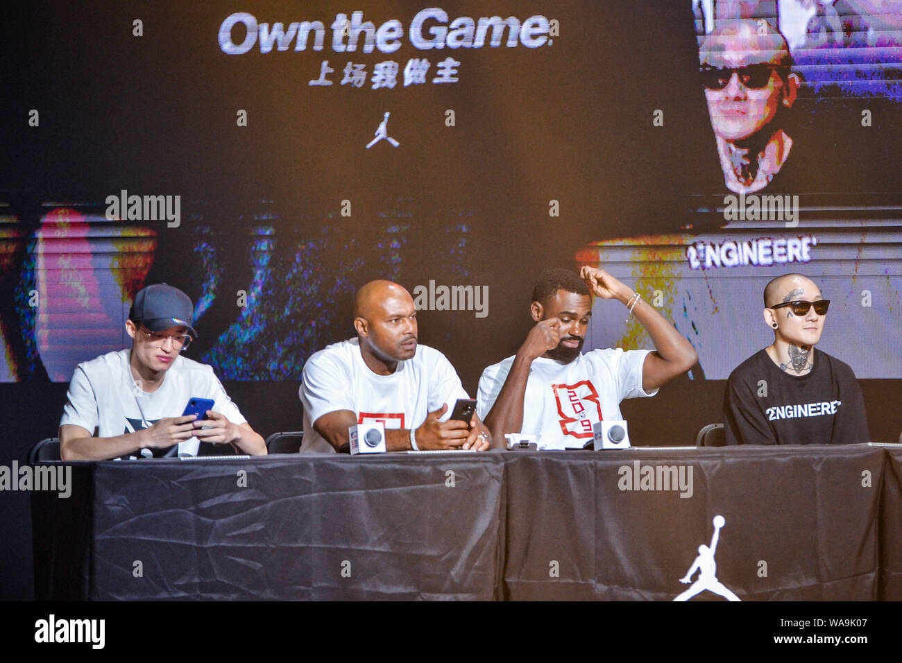 NBA star Tim Hardaway Jr., center left, of Dallas Mavericks, and ...