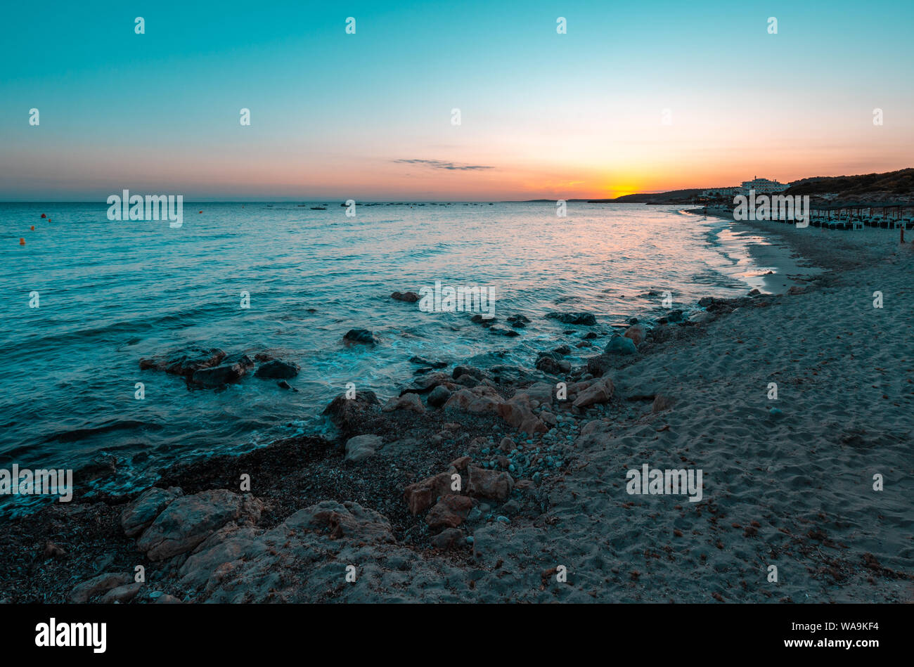 Sunset time in Santo Tomas beach on the island of Menorca Stock Photo ...