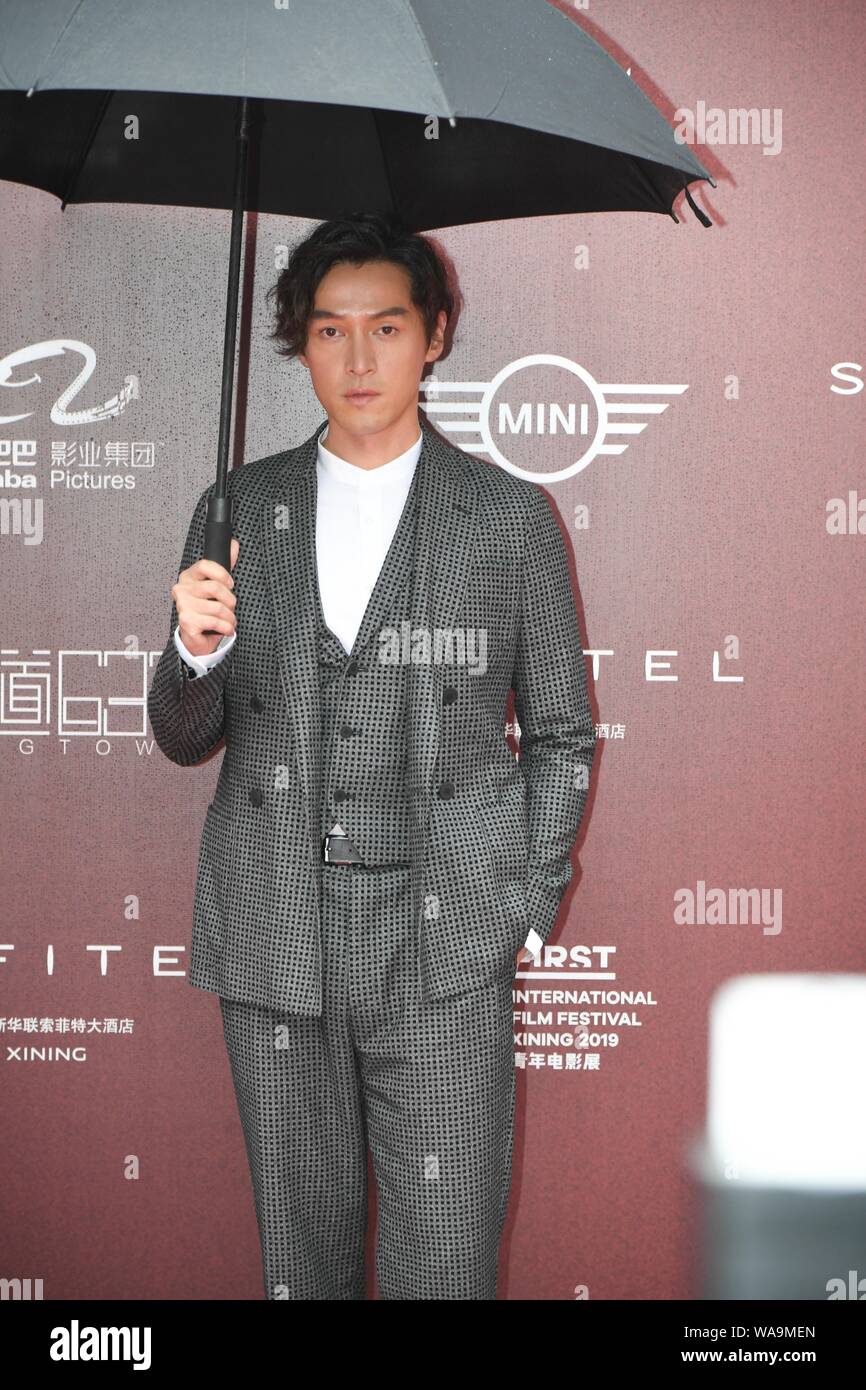 Chinese actor and singer Hu Ge poses as he arrives on the red carpet ...