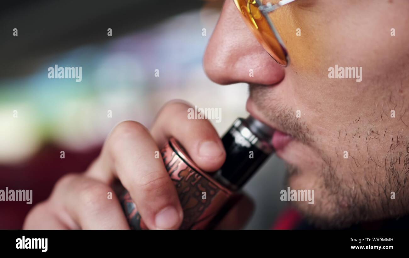 Young male man vaping in the street hi-res stock photography and images ...
