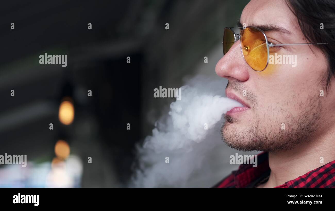 Young male man vaping in the street hi-res stock photography and images ...