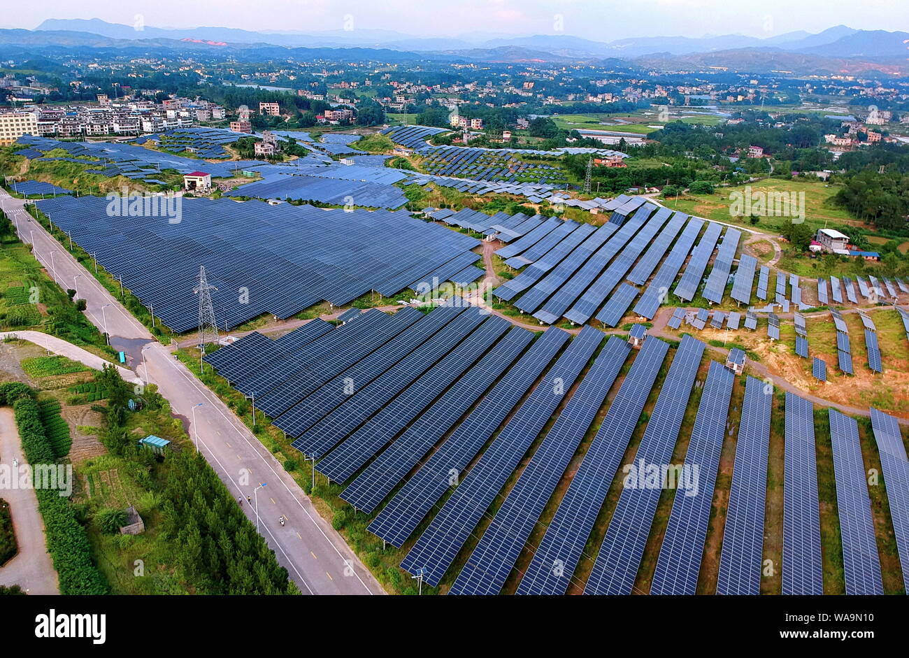 --FILE--Aerial view of arrays of solar panels installed around the ...