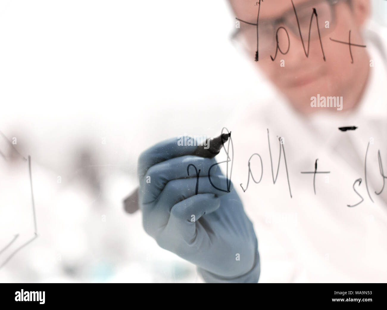 Scientists look at board hi-res stock photography and images - Alamy