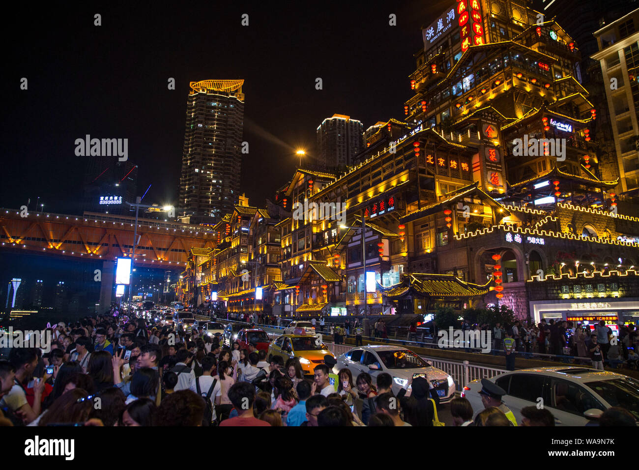 Travelers take photos of Hong Yang Dong in Chongqing, China, 3 May 2019 ...