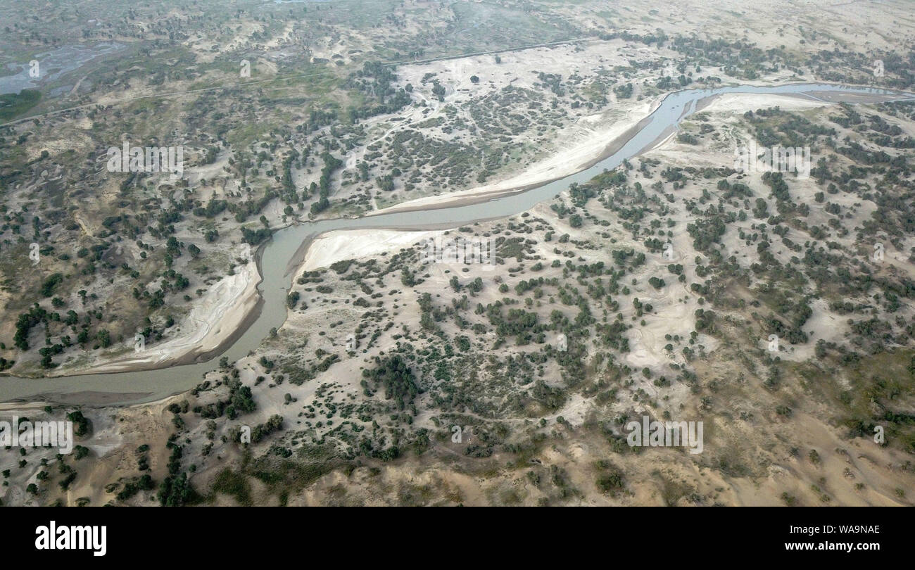 Landscape of the Tarim River embraced by green plants in Yuli county ...