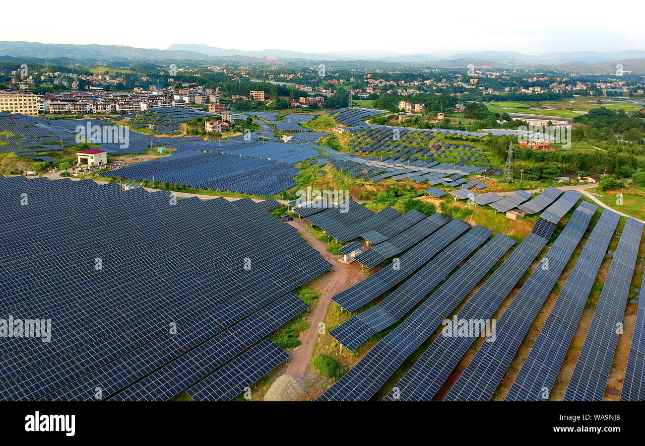 --FILE--Aerial view of arrays of solar panels installed around the ...