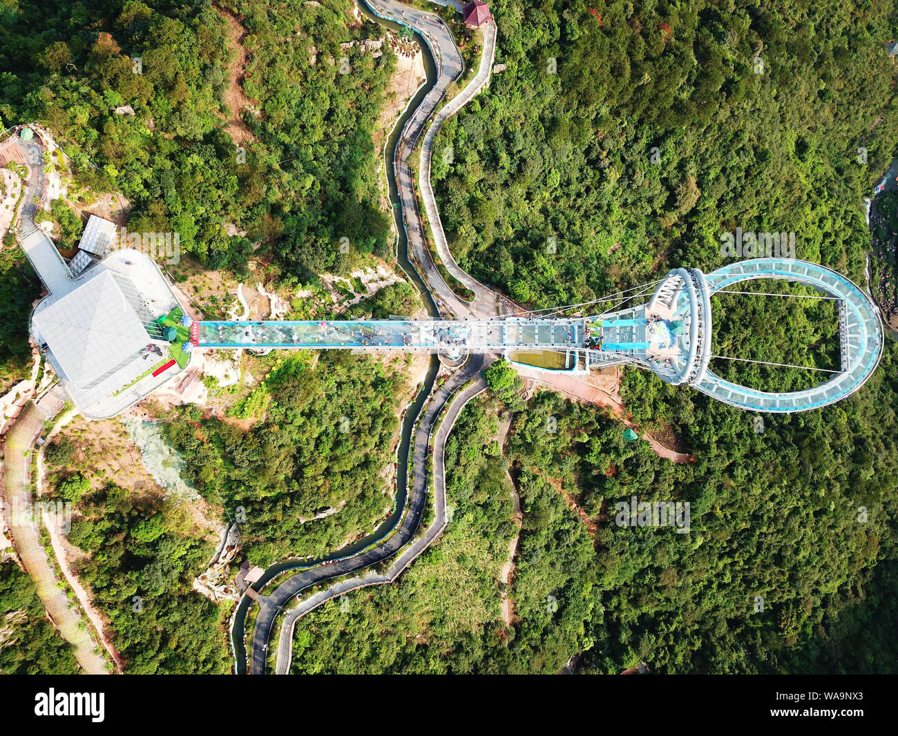 Aerial view of Guangdong's highest circular glass bridge crossing on ...