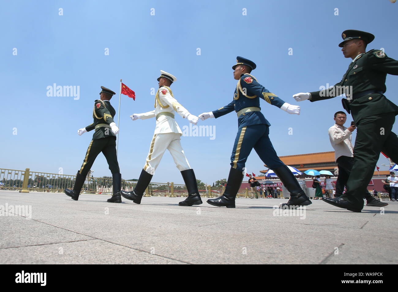 Chinese paramilitary policemen patrol the Tian'anmen Square on a ...
