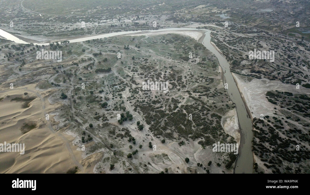 Landscape of the Tarim River embraced by green plants in Yuli county ...
