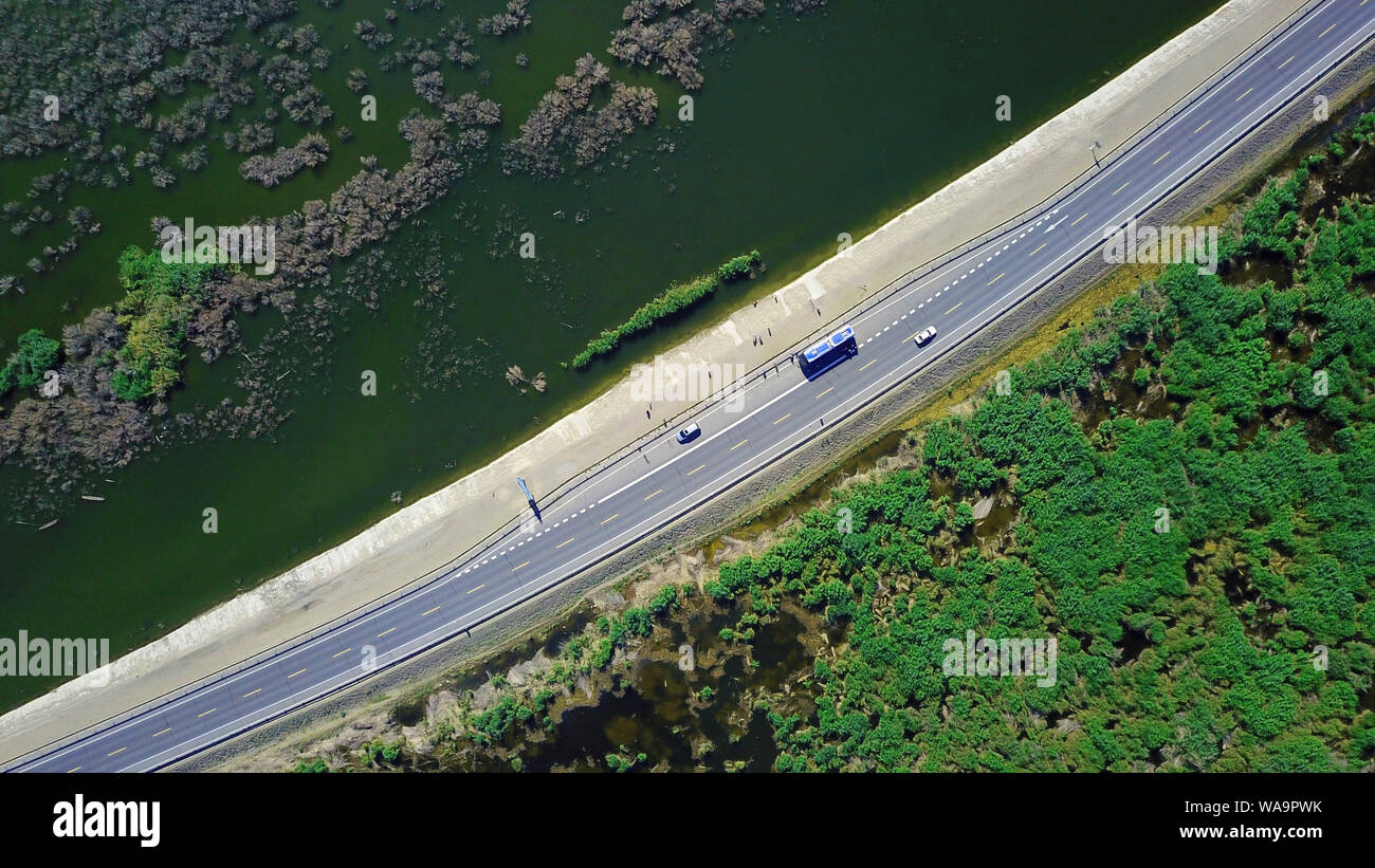 Aerial view of a highway around the Bosten Lake, one of the largest ...