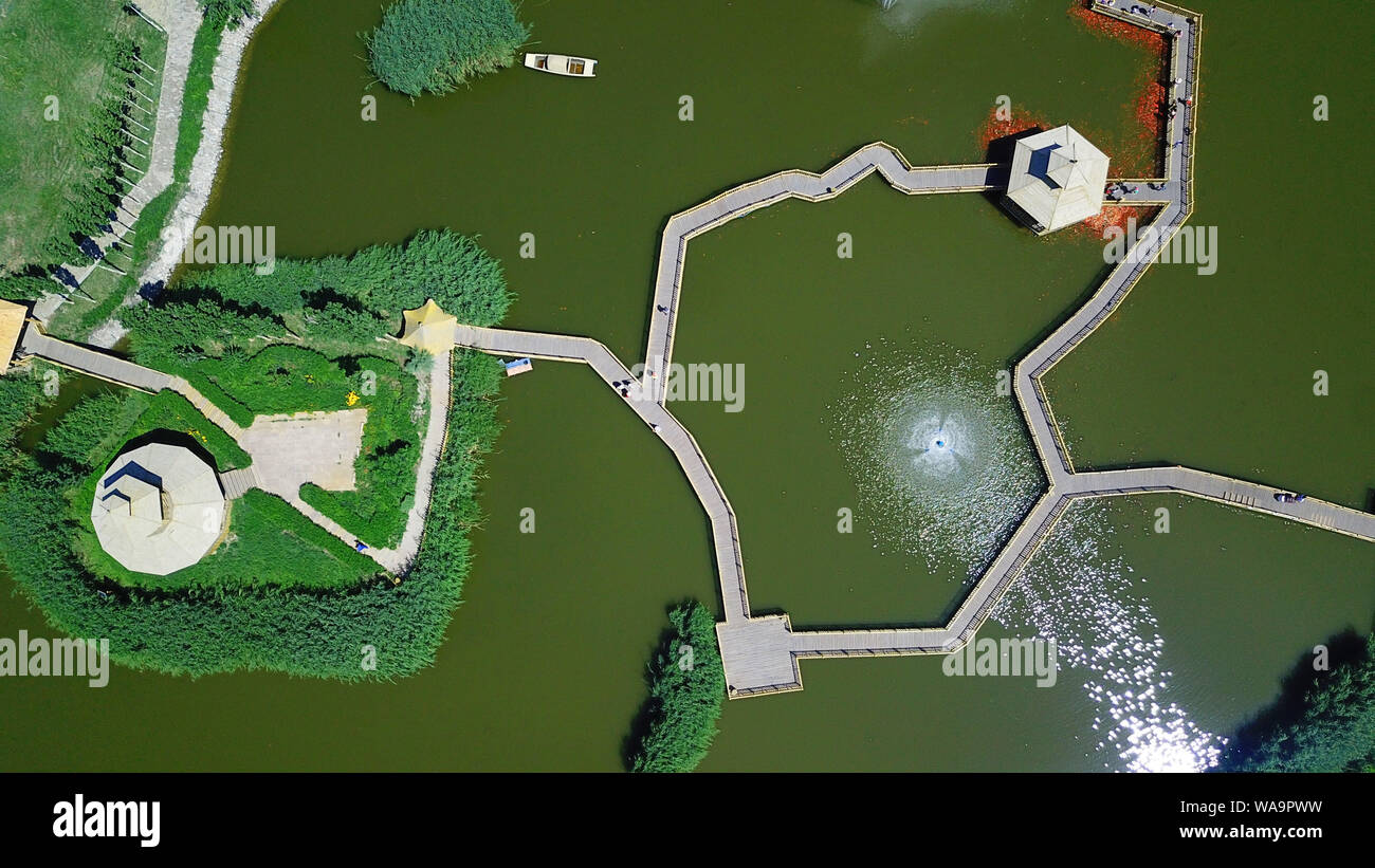 Aerial view of a highway around the Bosten Lake, one of the largest ...