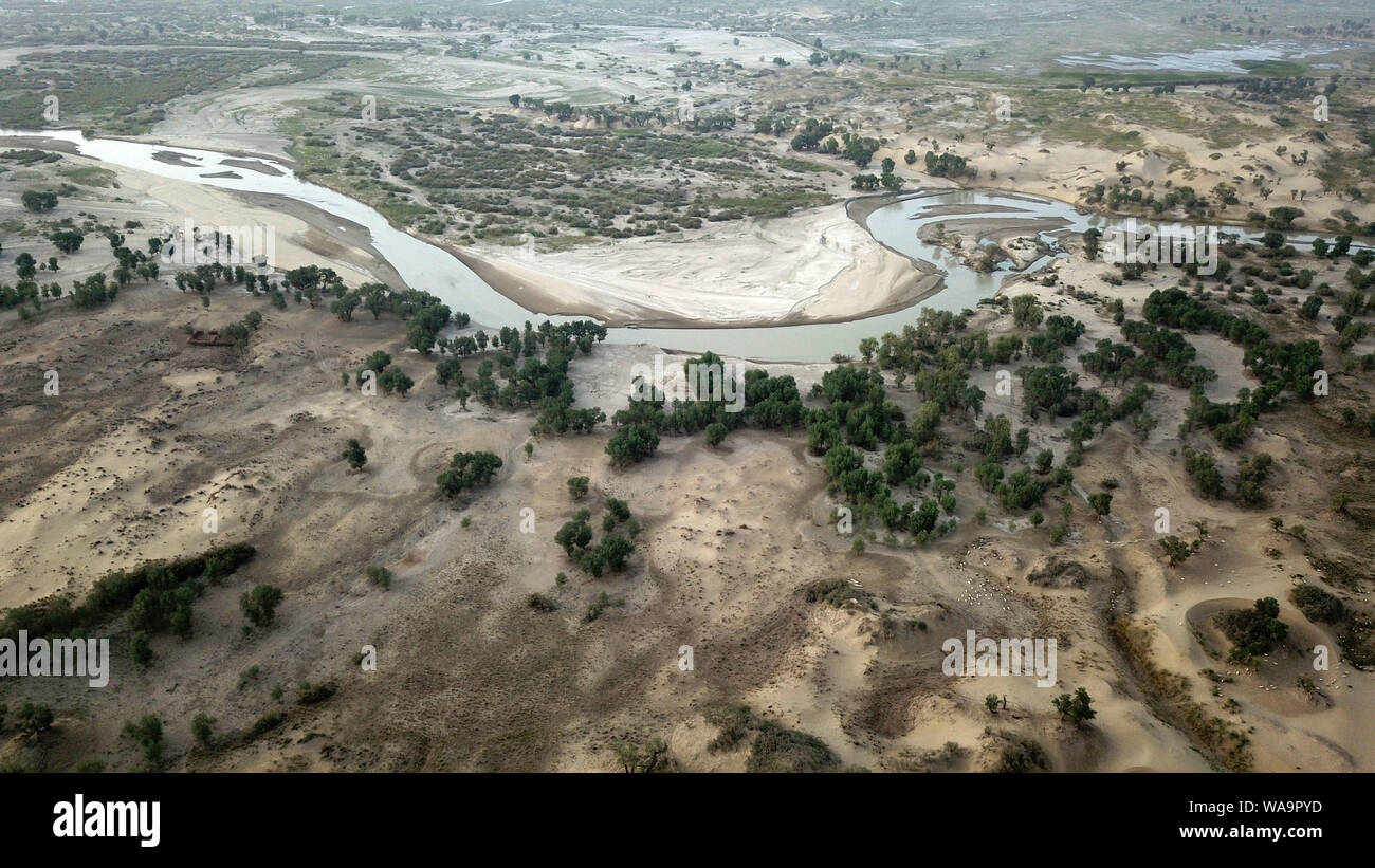 Landscape of the Tarim River embraced by green plants in Yuli county ...