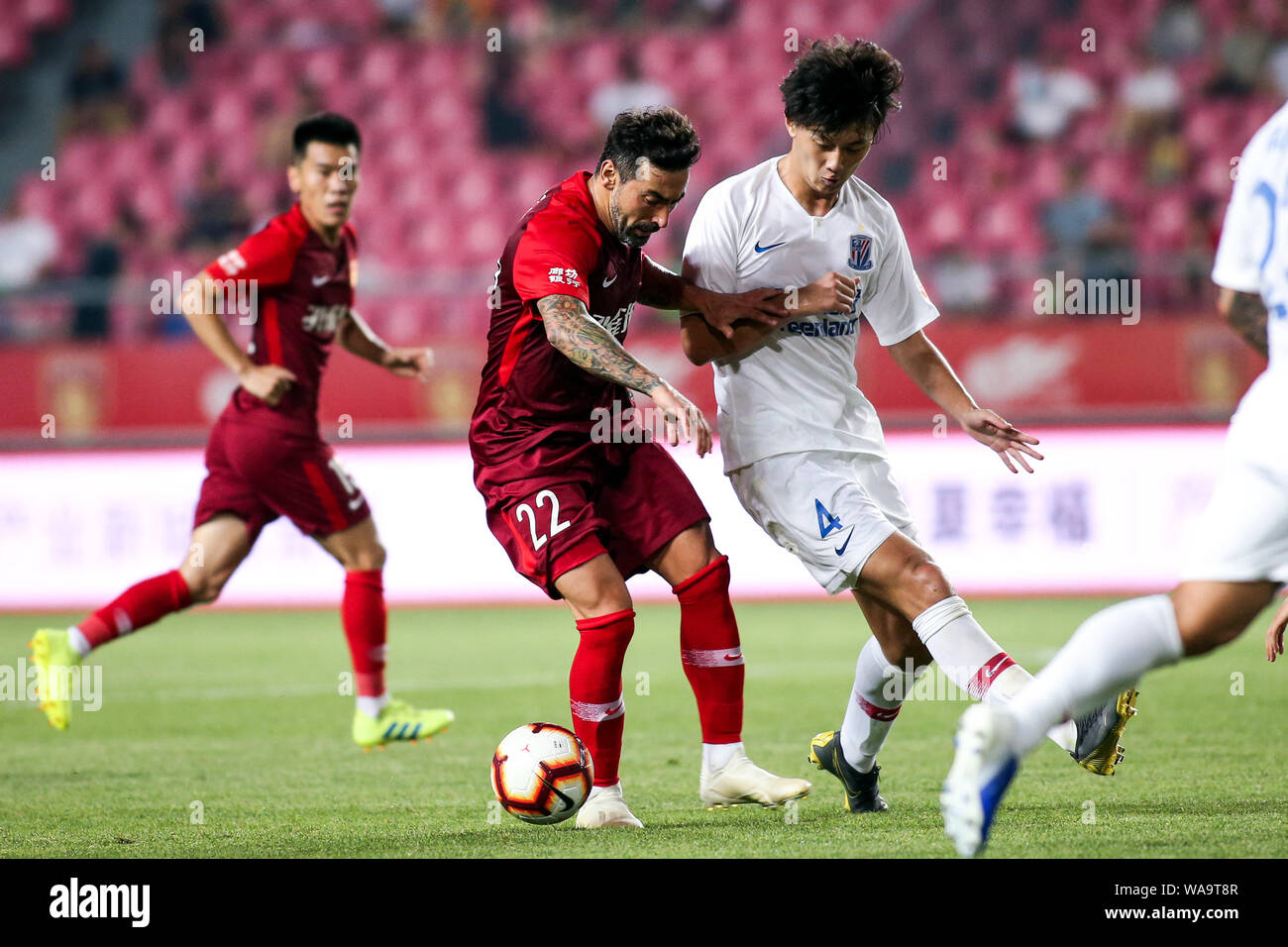 Argentine football player Ezequiel Lavezzi, left, of Hebei China ...