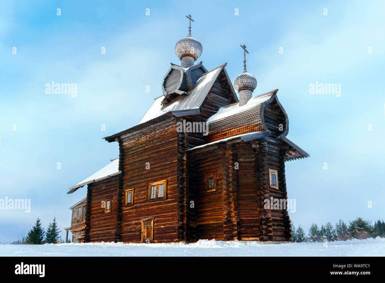 ancient russian wooden log village orthodox church in winter landscape ...