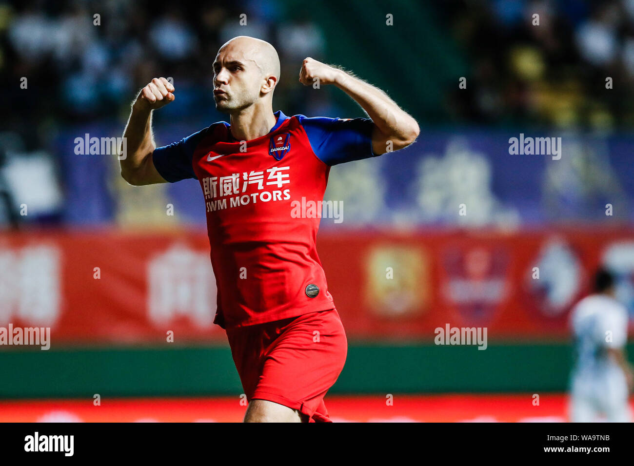 Polish football player Adrian Mierzejewski of Chongqing SWM celebrates ...