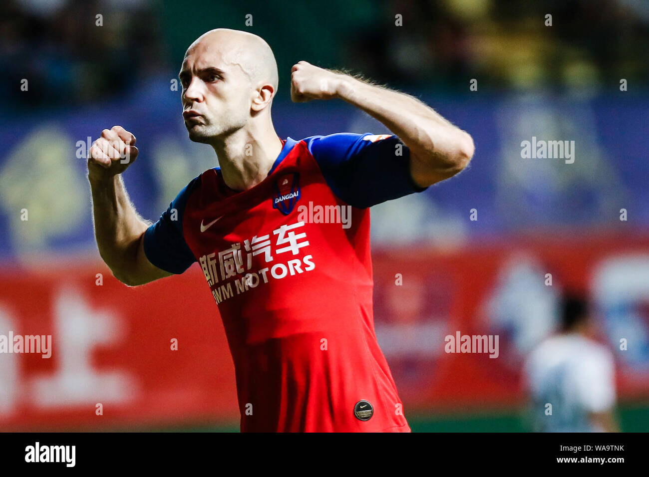 Polish football player Adrian Mierzejewski of Chongqing SWM celebrates ...