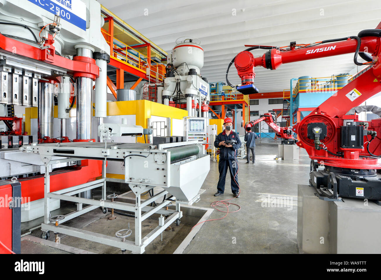 -FILE-An employee works in an automated factory in Huzhou city, east ...
