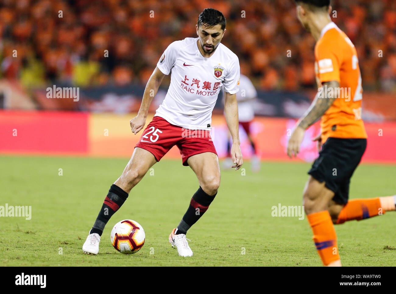 Uzbek football player Odil Ahmedov of Shanghai SIPG dribbles against ...
