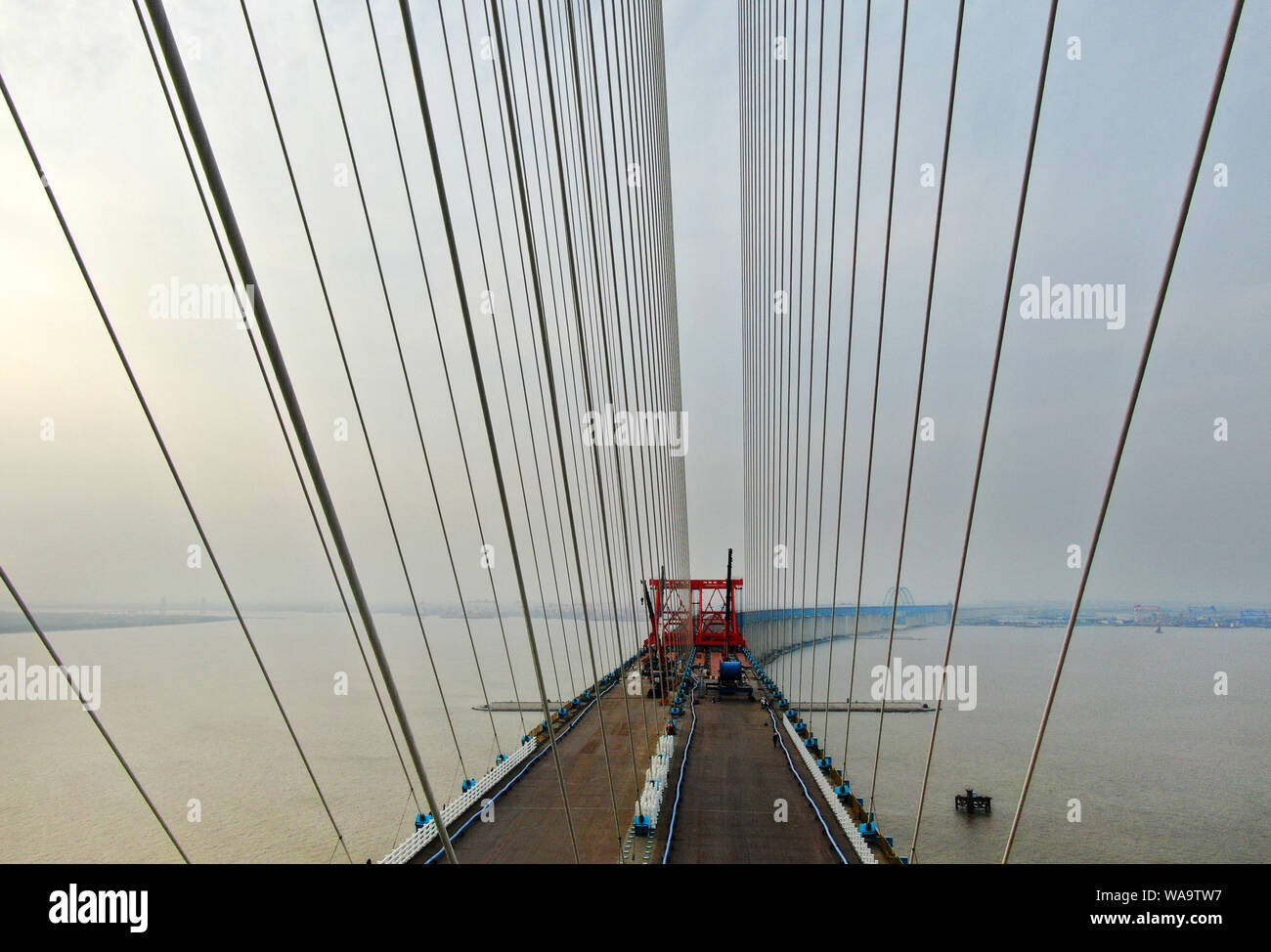 Chinese workers labor at the construction site of world's longest cable ...