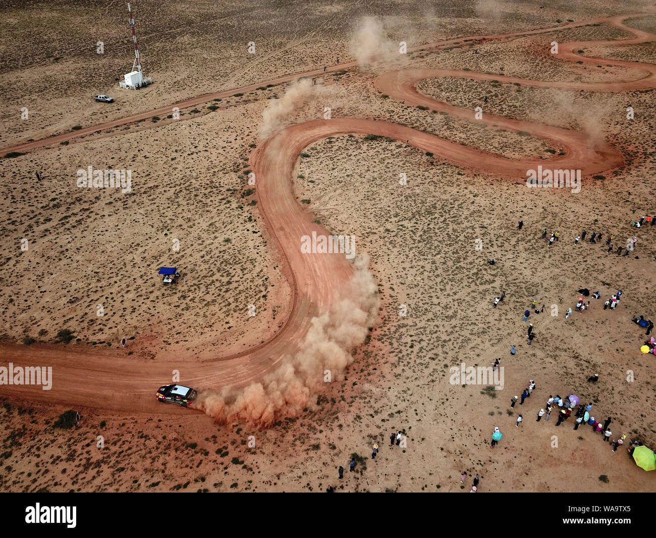 Local residents and tourists watche racing cars competing in the 2019 ...
