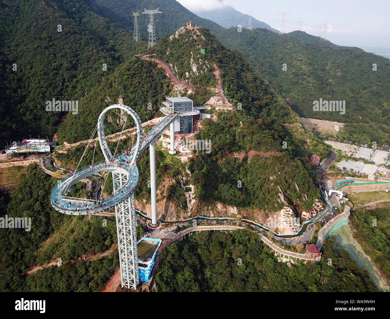 Aerial view of Guangdong's highest circular glass bridge crossing on ...