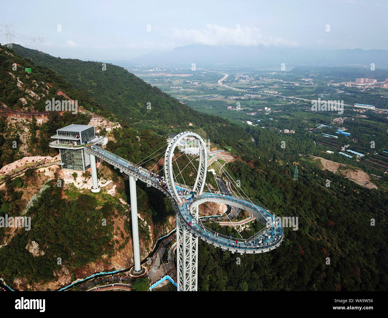 Aerial view of Guangdong's highest circular glass bridge crossing on ...