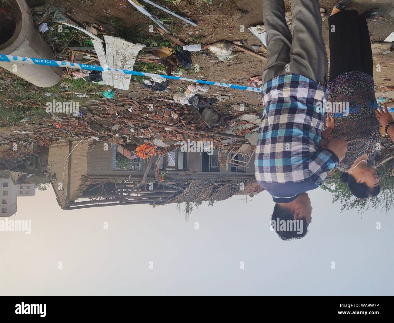 Residential buildings are devastated by strong winds caused by a ...