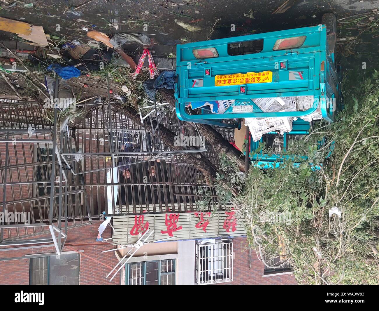 A tricycle is devastated by strong winds caused by a tornado in Kaiyuan ...