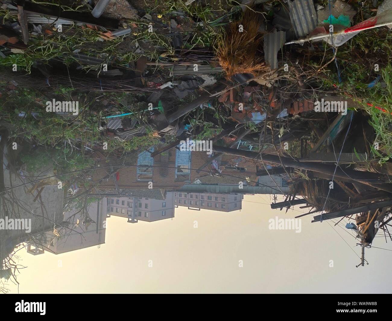 Residential buildings are devastated by strong winds caused by a ...