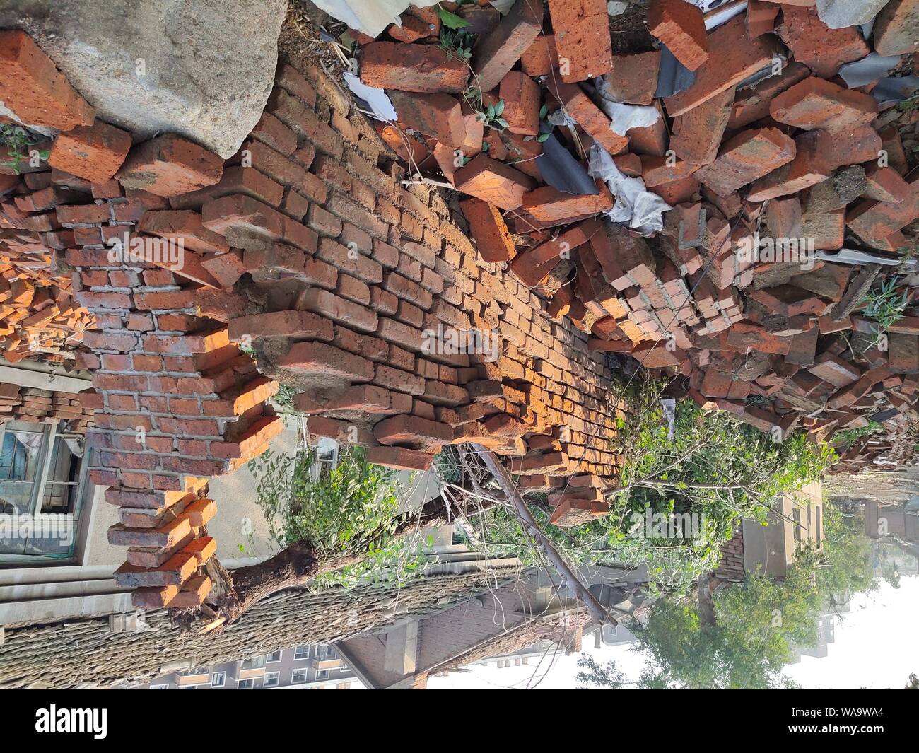 A residential building is devastated by strong winds caused by a ...