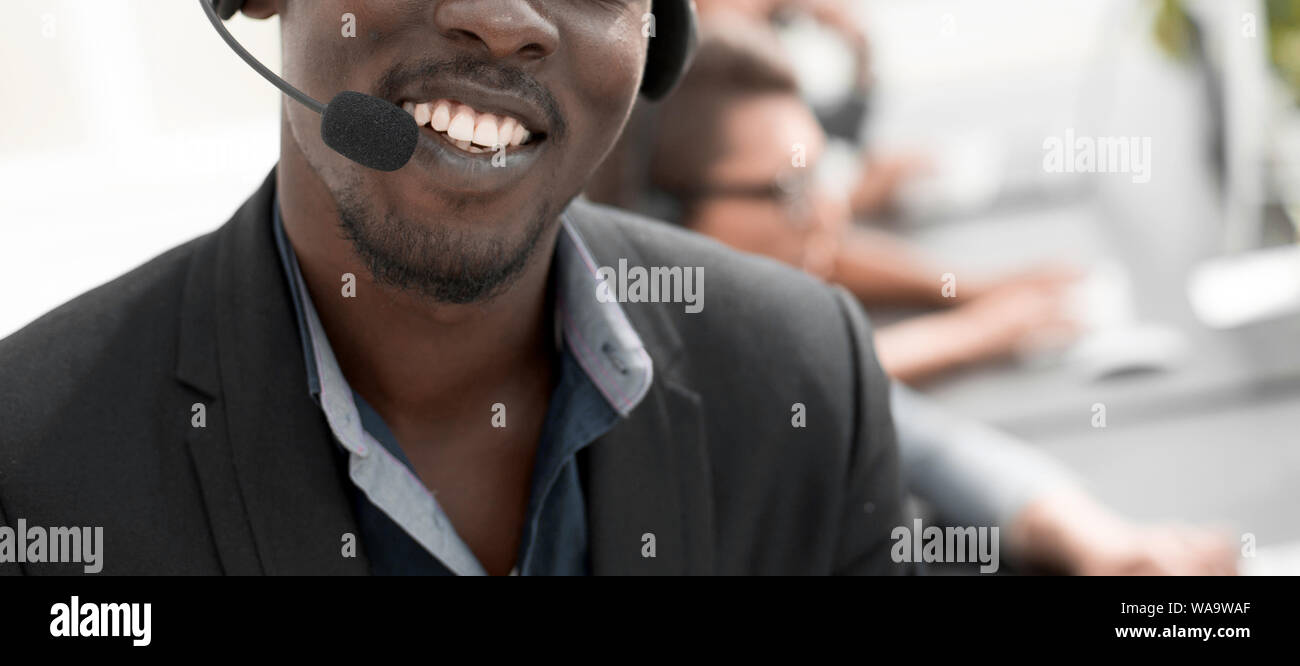 close up.call center operator on blurred background Stock Photo - Alamy