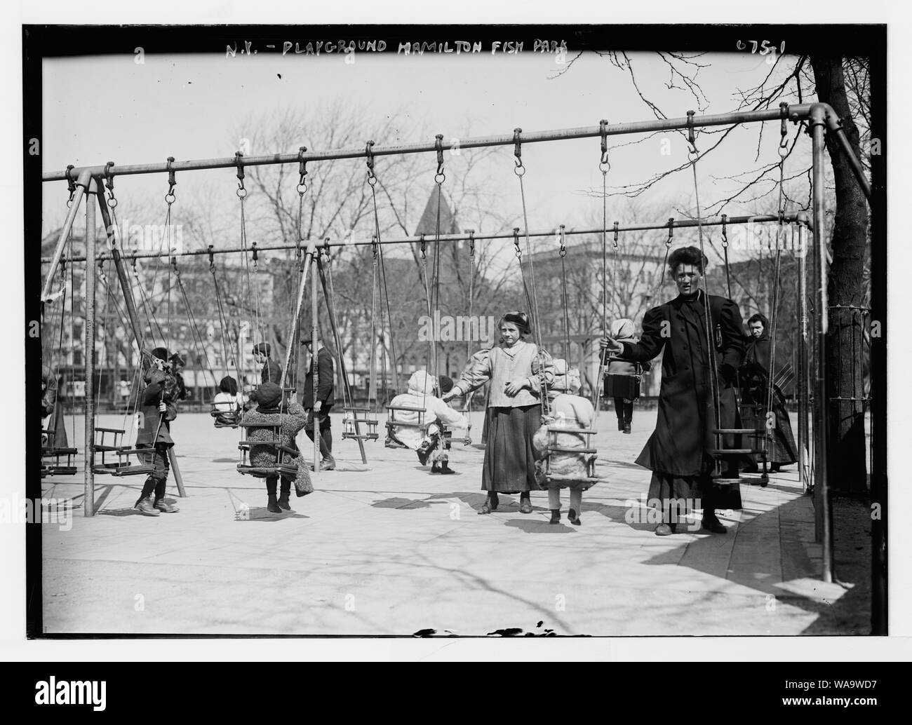 Children in swings, Hamilton Fish Park, New York Stock Photo - Alamy