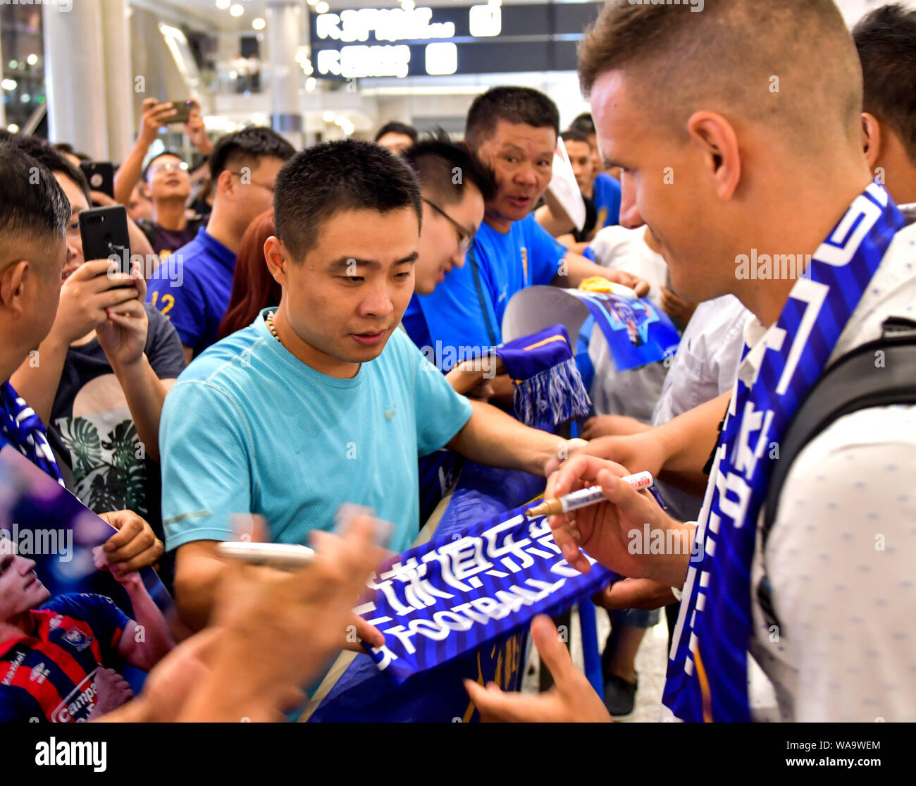 Croatian football player Ivan Santini, top, of China's Jiangsu Suning F ...