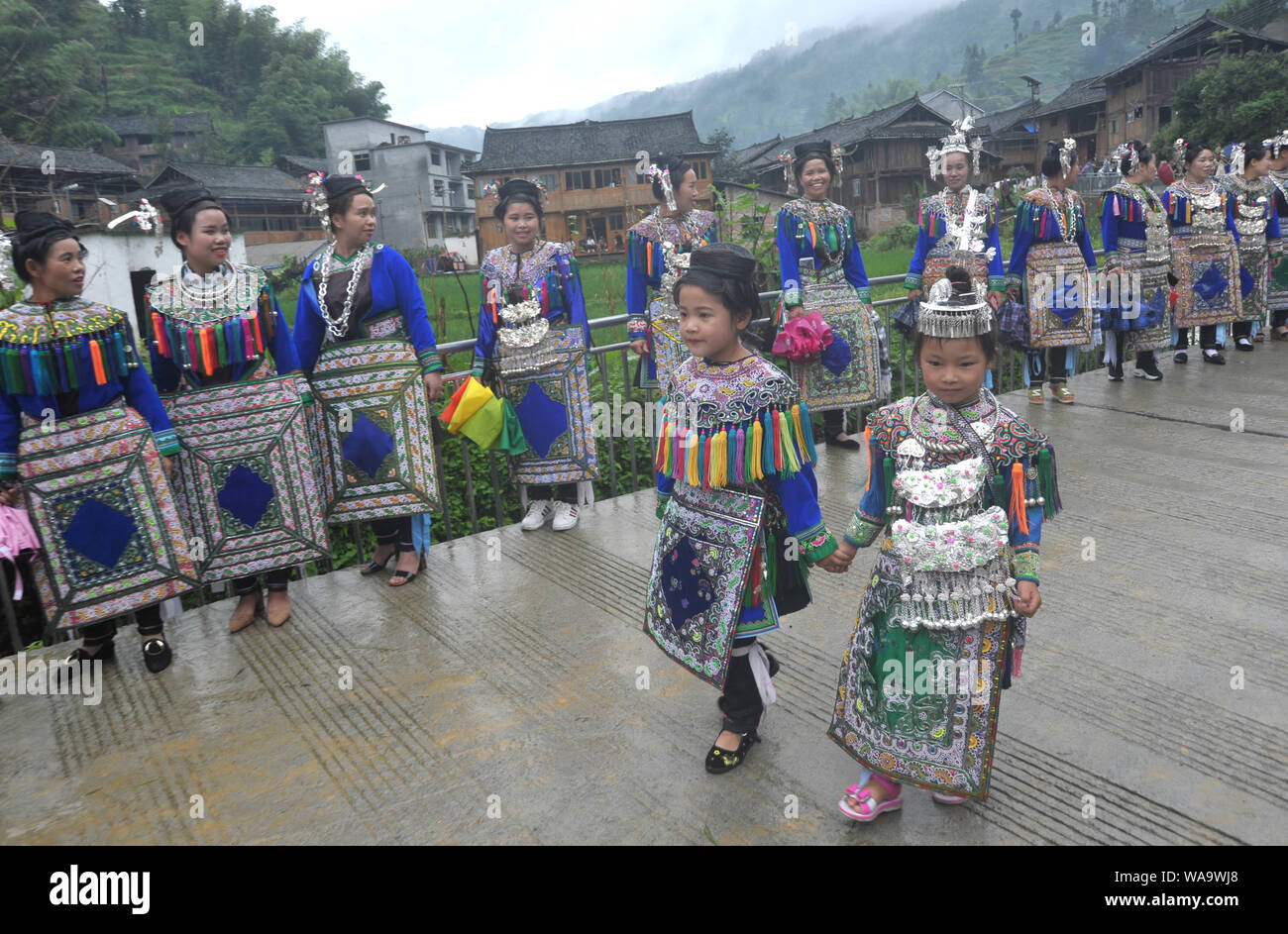 Chinese people of Dong ethnic group wearing traditional costumes and ...