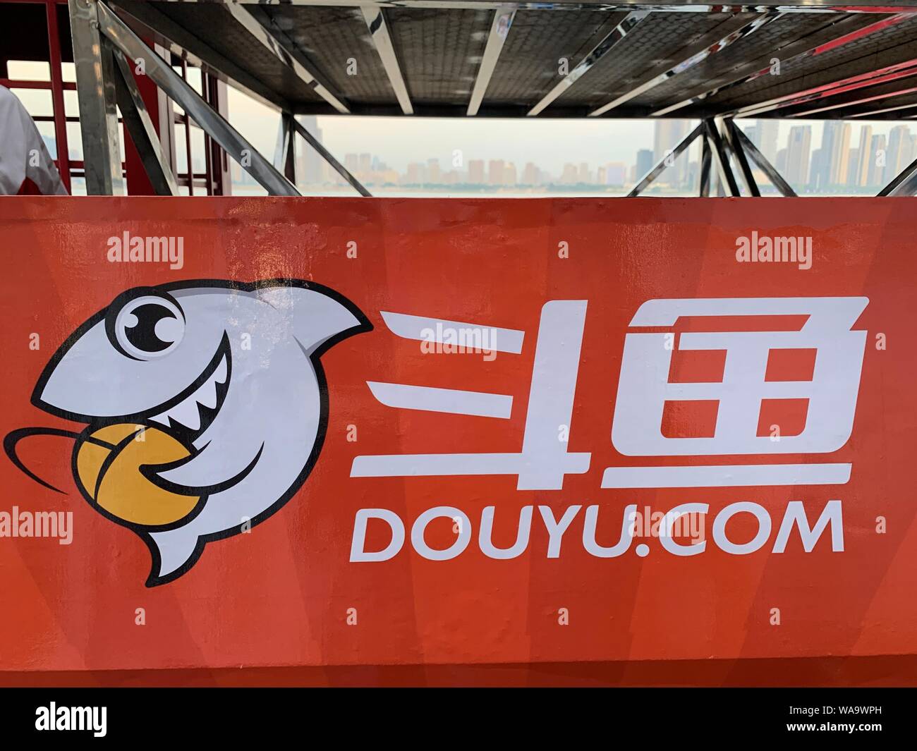 --FILE--View of a signboard of DouYu International Holdings, in Wuhan ...