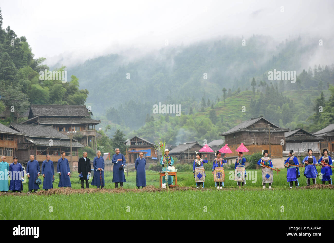 Chinese people of Dong ethnic group wearing traditional costumes and ...